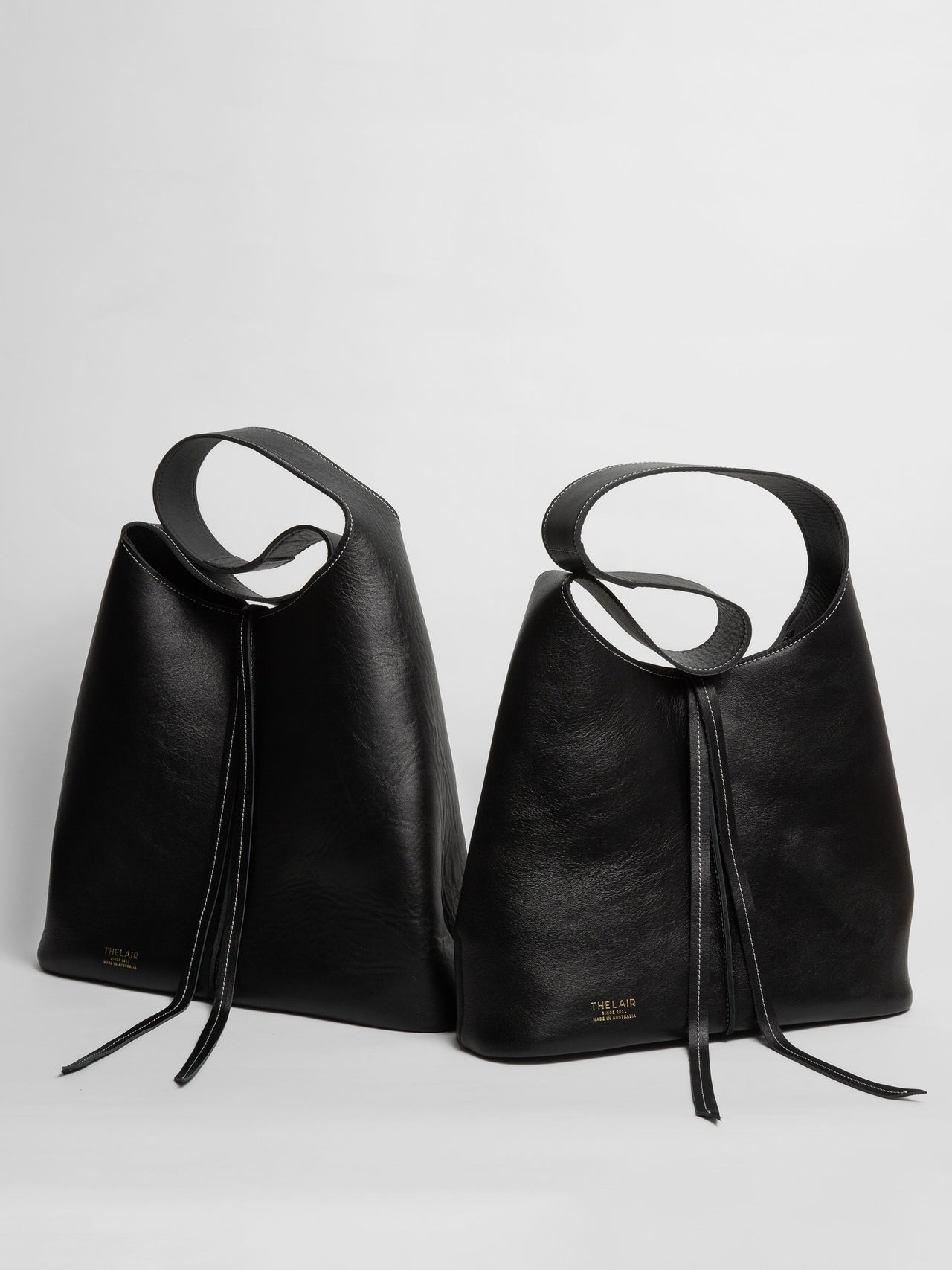 The Lair Suedo Sling Bag Small Black Gold